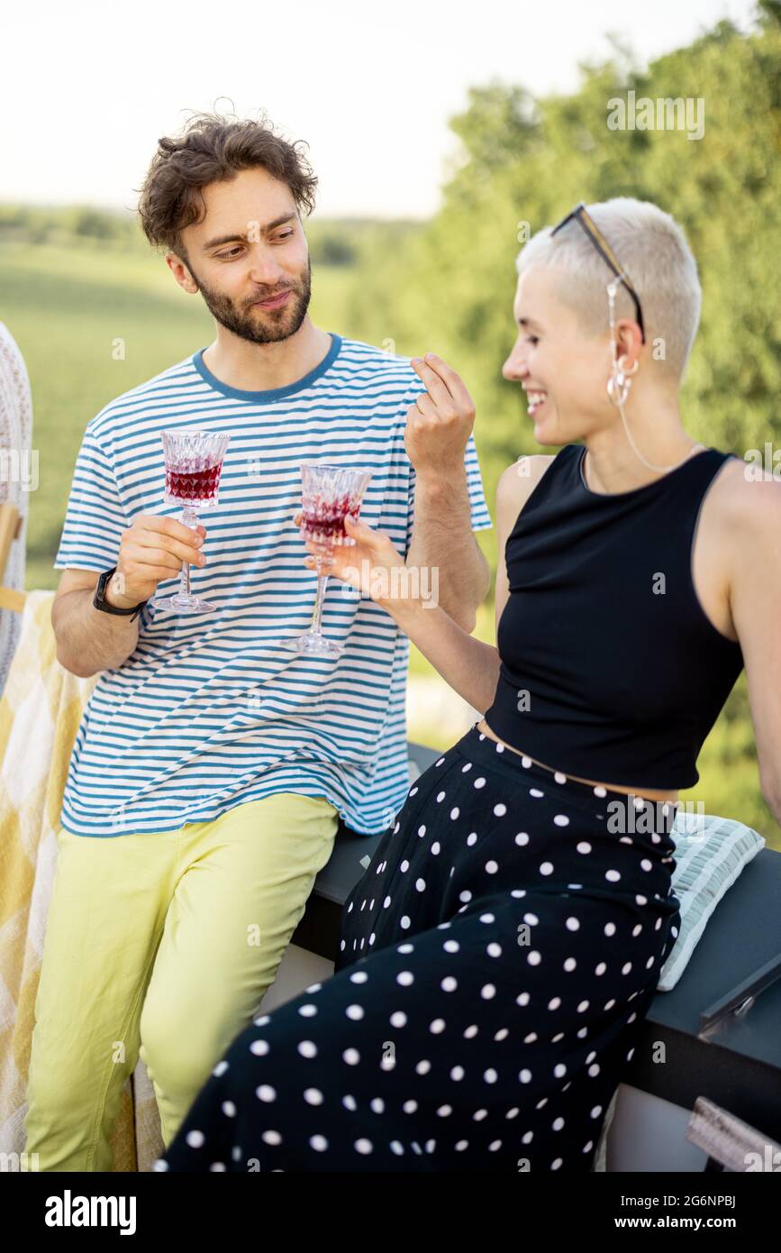 Two friends hanging out at picnic outdoors Stock Photo - Alamy Two friends hanging out at picnic outdoors Stock Photo - Alamy