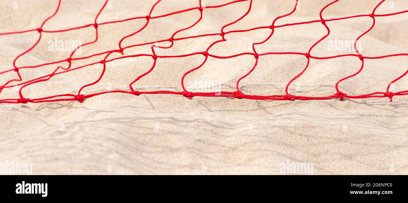 Beach volleyball and beach tennis net on the background of sand. Summer ...