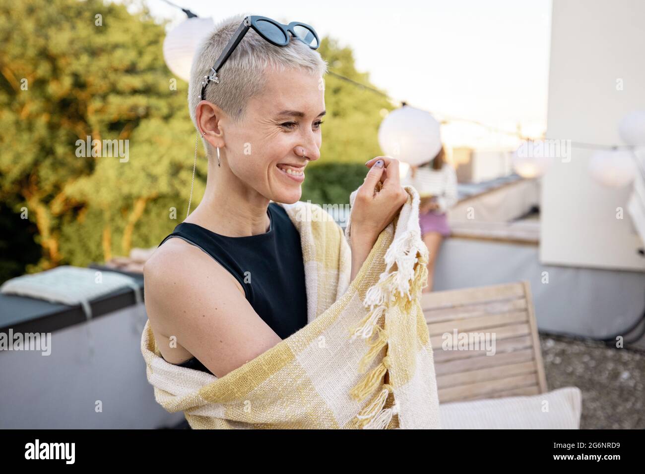 Stylish person hanging out on the roof terrace Stock Photo - Alamy