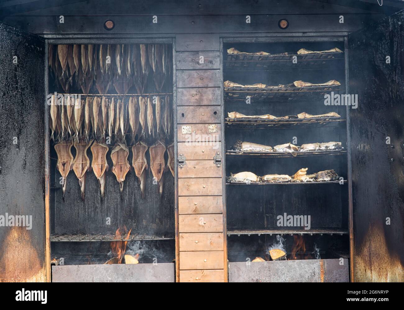 Freshly caught sea fish is smoked in smokehouse Stock Photo - Alamy