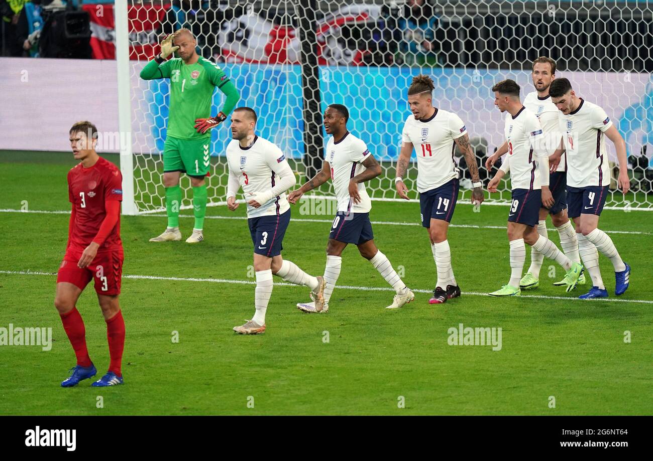 England players celebrate their first goal which was an own goal scored ...
