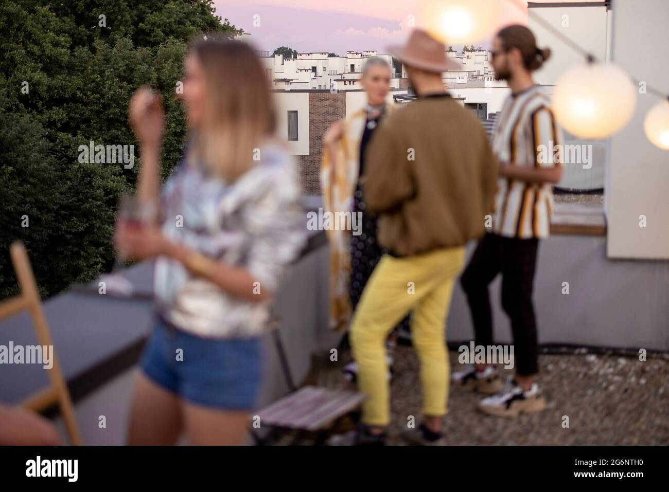 Rooftop gathering friends enjoying hi-res stock photography and images ...