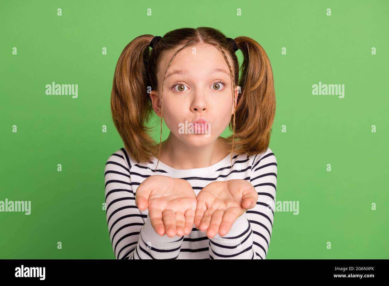 Photo of pretty tails hairdo small girl blow kiss wear striped sweater ...