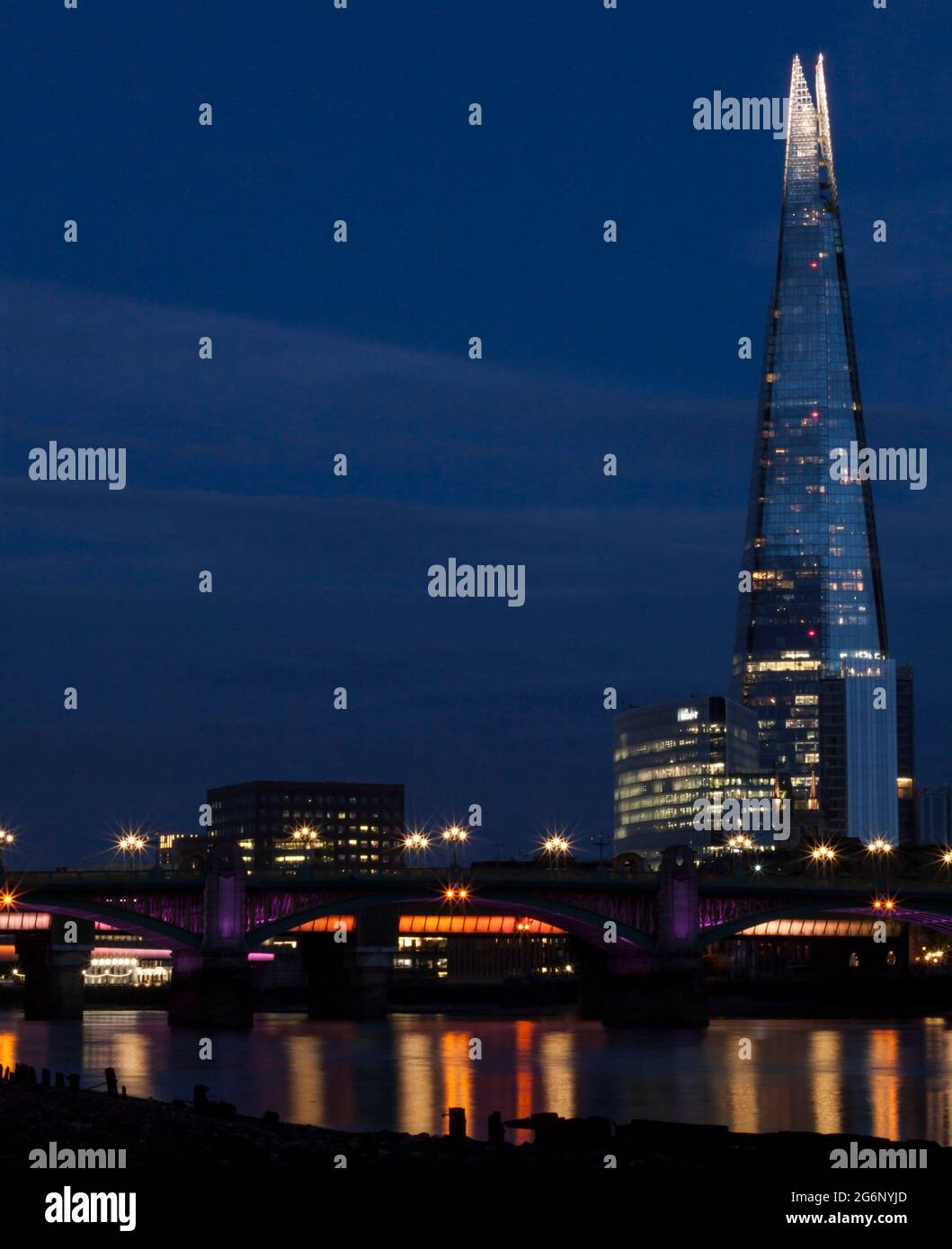 The Shard in Central London at Dusk reflecting in the Thames River ...