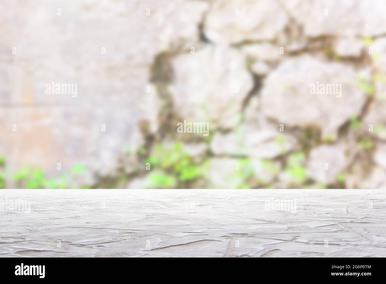 white textured surface on blur stone wall background Stock Photo - Alamy