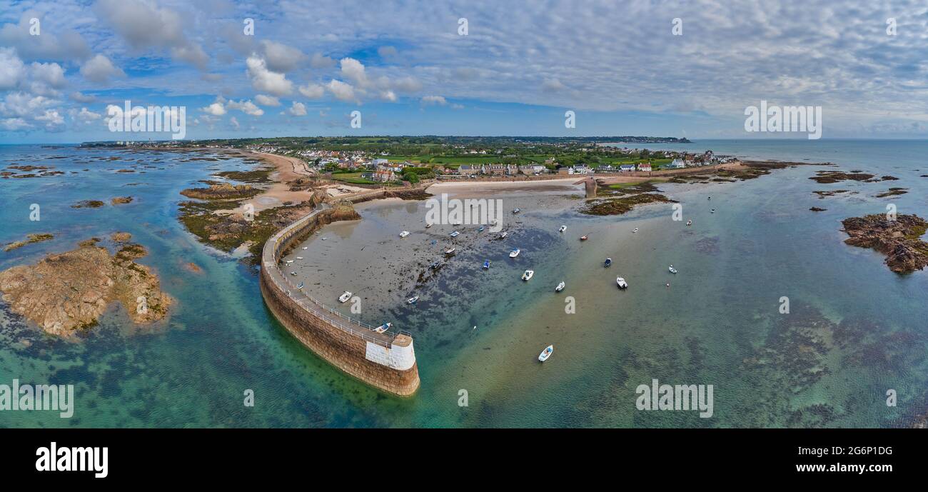 Panaramic image of La Rocque Harbour at half tide with blue sky and ...