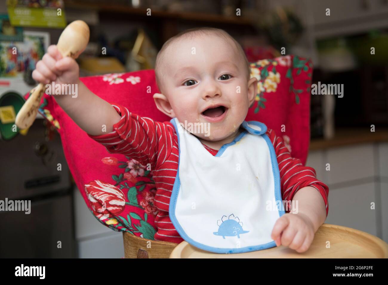 Child learning to eat with spoon hi-res stock photography and images ...