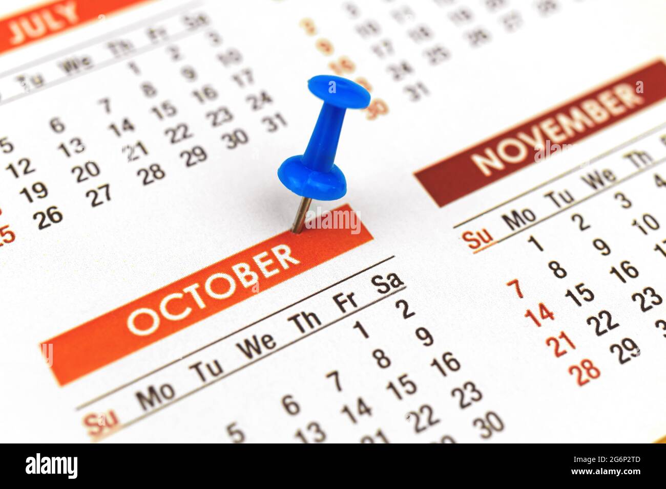 Calendar with push pin, october month close-up, planner concept ...