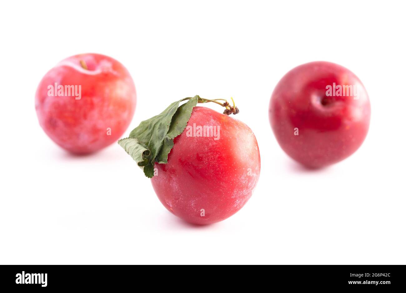 Three whole ripe red plums hi-res stock photography and images - Alamy