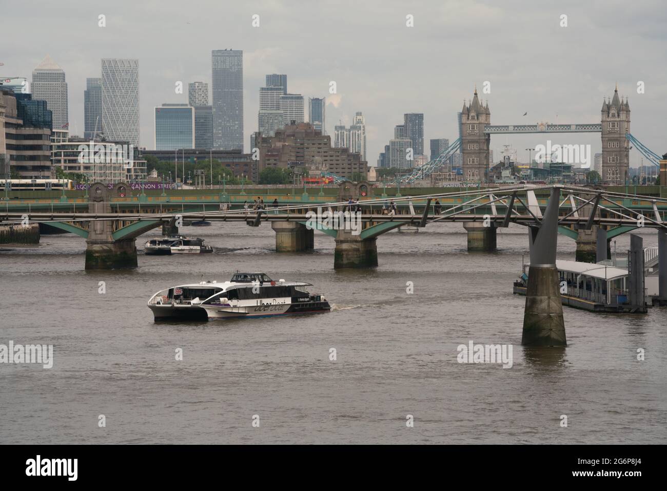 Uber boat by Thames Clippers departing London Bridge pier Stock Photo ...