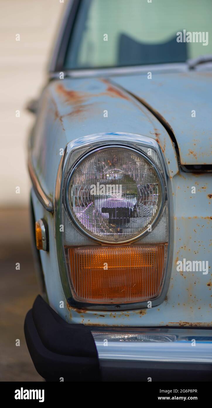 Front Headlight view of a classic blue car Stock Photo - Alamy