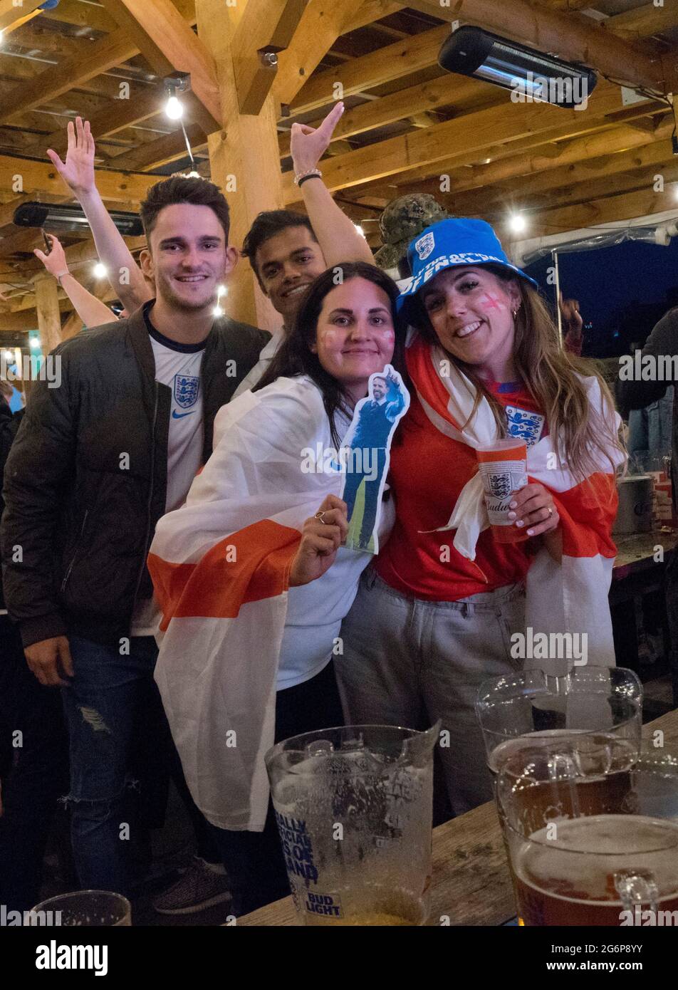 England football fans and supporters at a rooftop beer garden in London ...