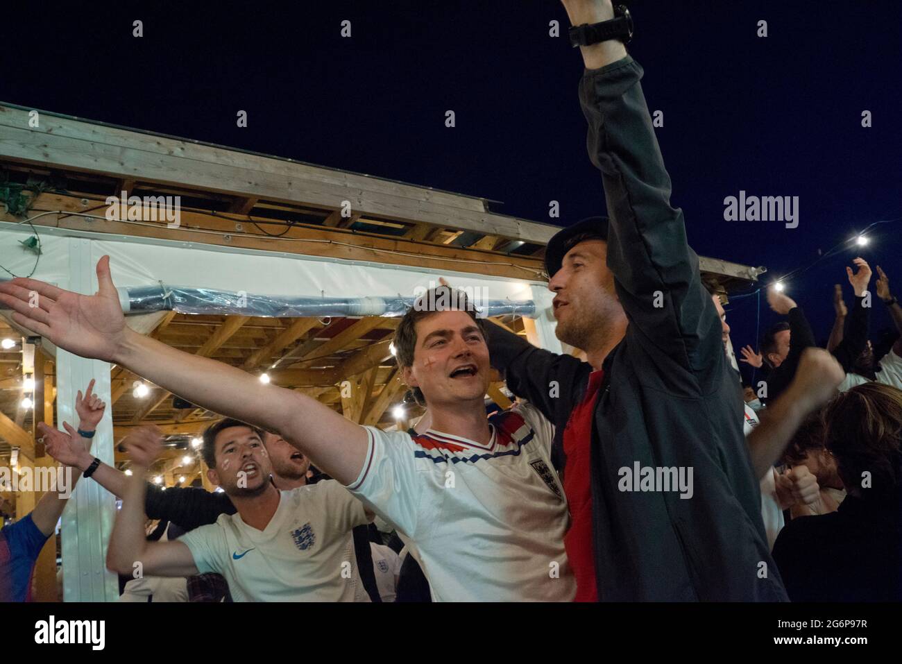 England football fans and supporters at a rooftop beer garden in London ...