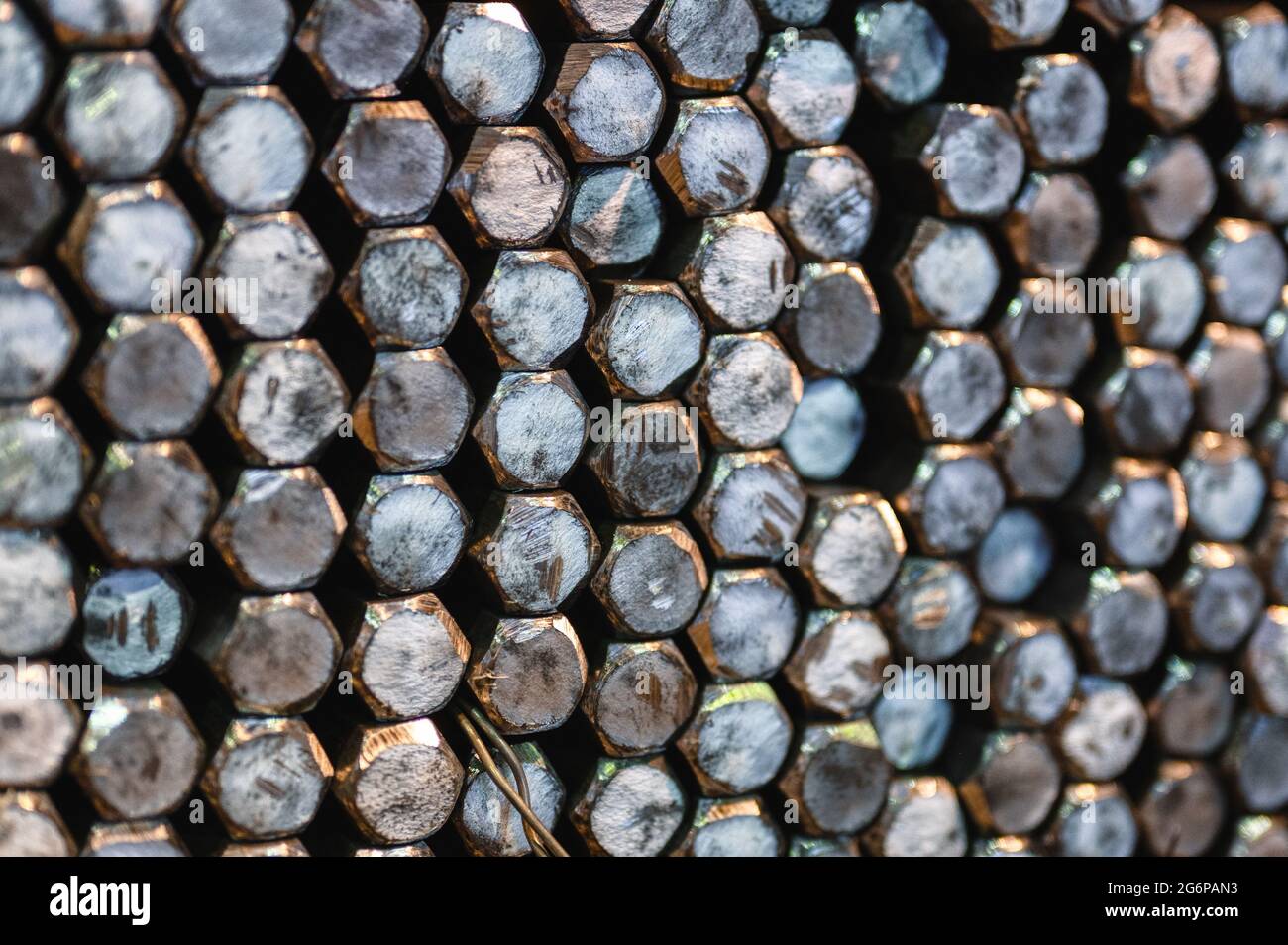 Hot rolled steel, bundle of round metal rods close-up Stock Photo - Alamy