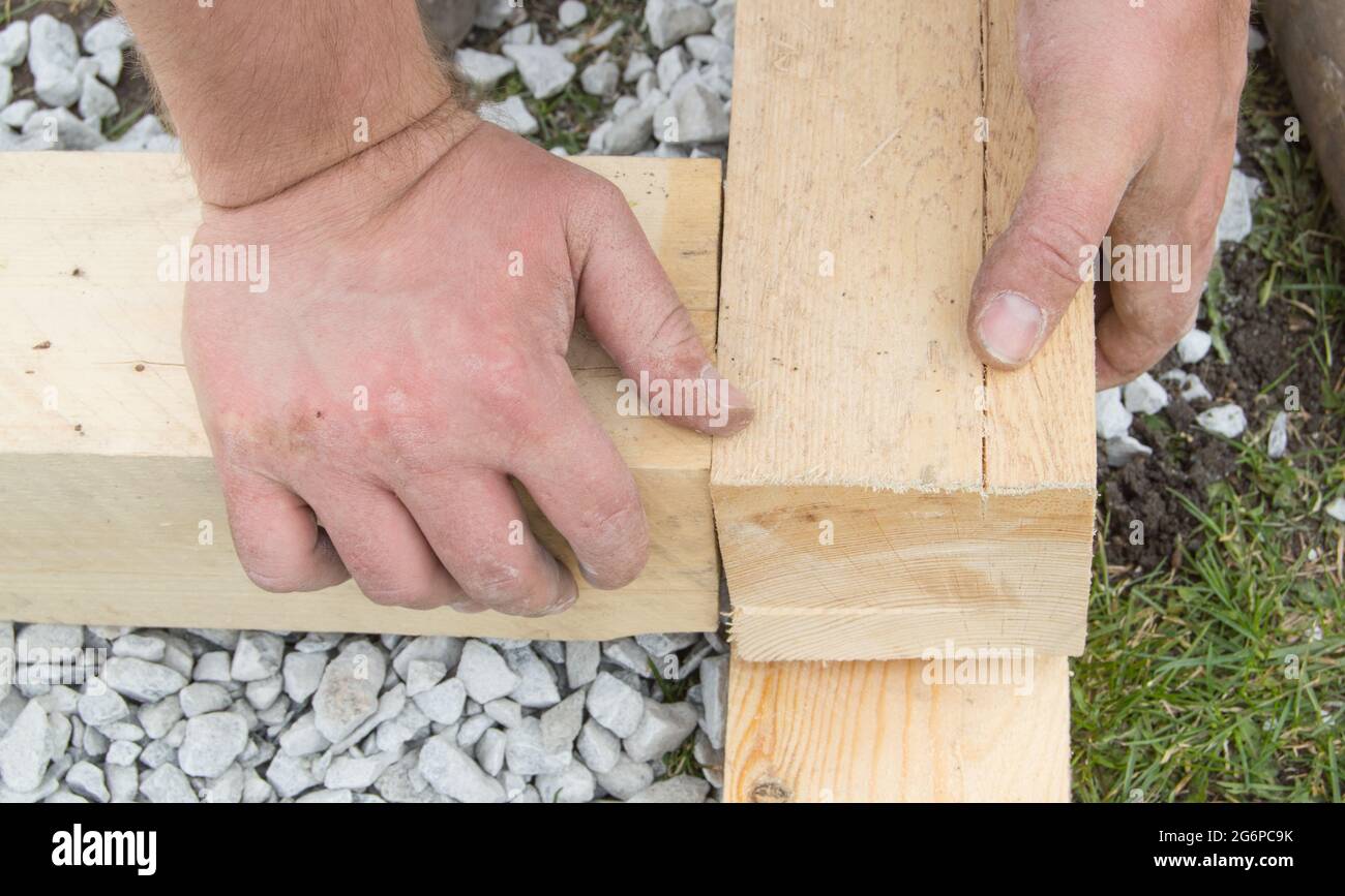 Close-up of rough male hands using new lumber for work, outdoors Stock ...