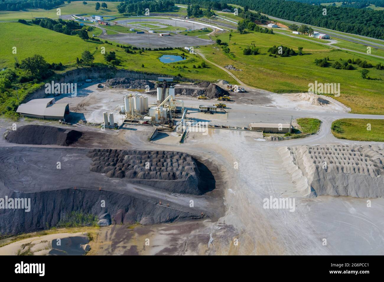 Aerial view of opencast mining quarry with of machinery at work ...