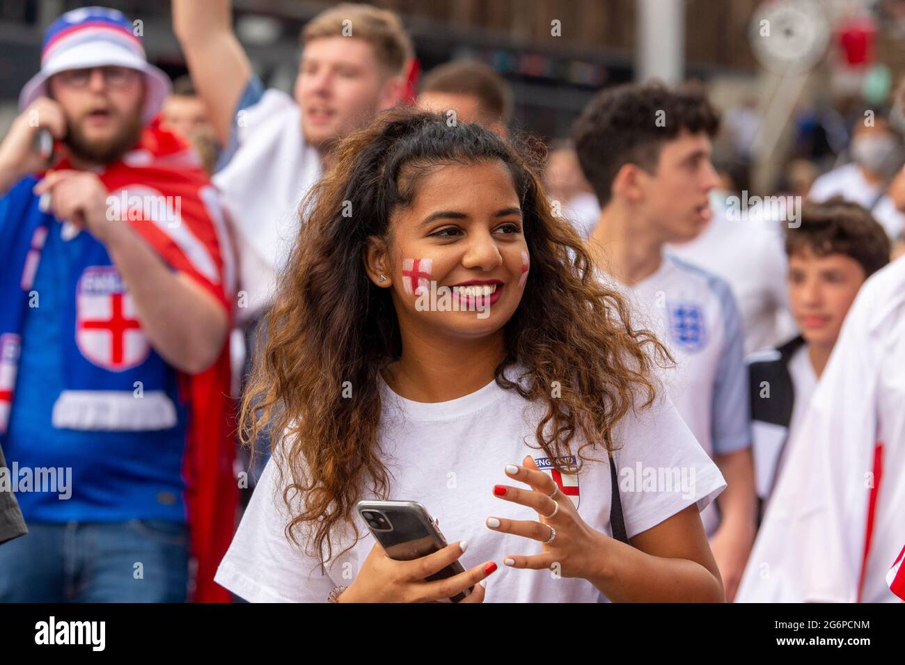 An England fan is all smiles as she arrives at Wembley Stadium ahead of ...