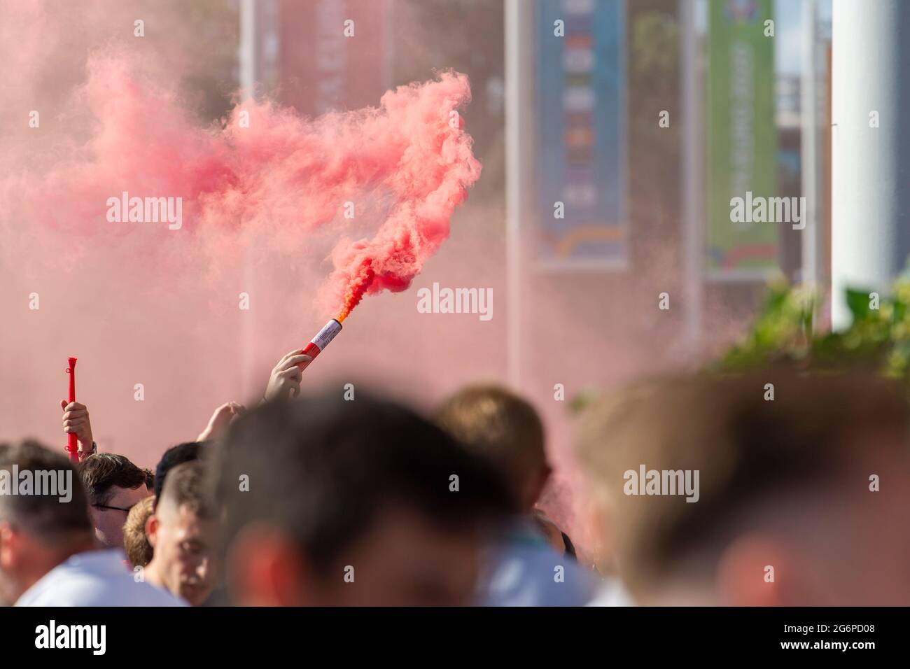 London, UK. 07th July, 2021. Fans let off smoke flares outside Wembley ...