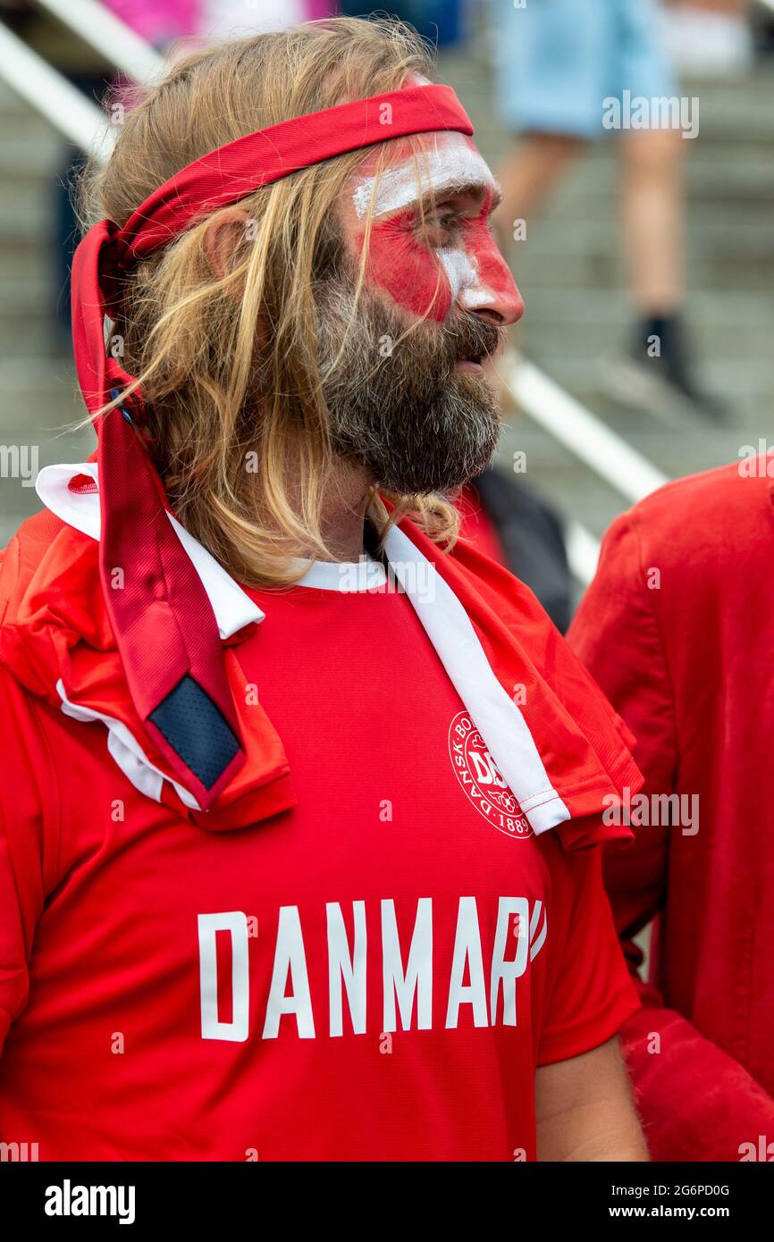 London, UK. 07th July, 2021. Danish fan with face paint arrives at ...
