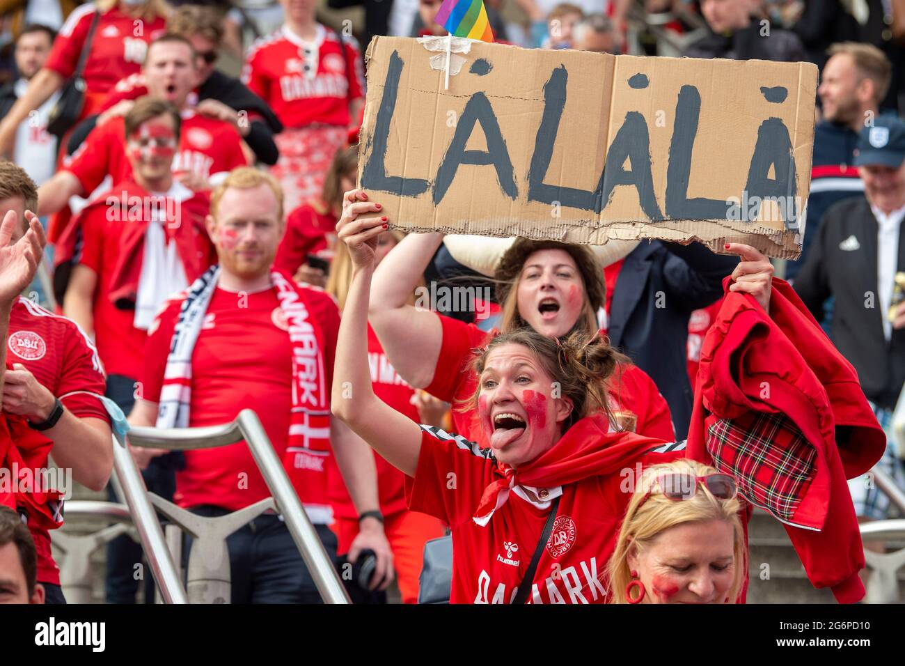 London, UK. 07th July, 2021. Danish fans arrive as a woman pokes her ...