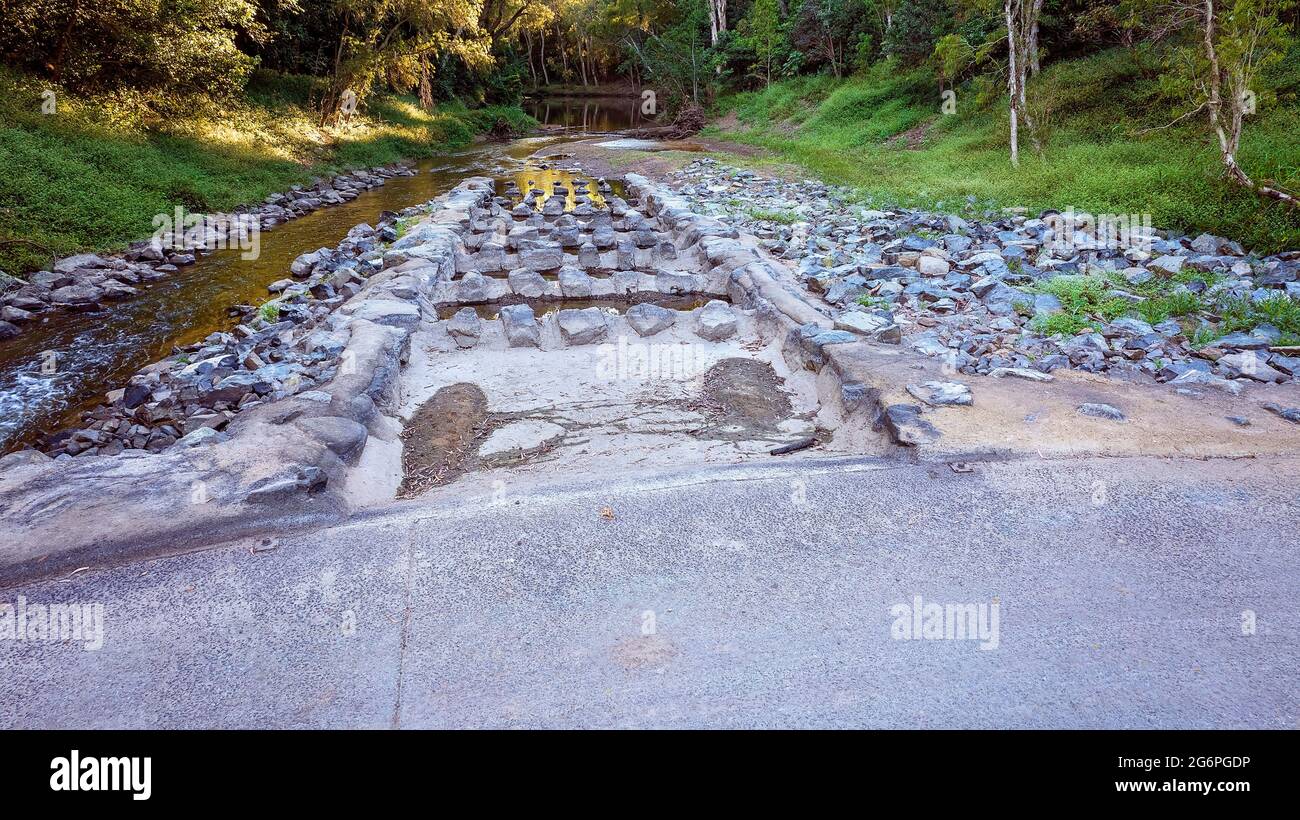 Causeway built to improve fish migration into a creek, seasonally dry ...