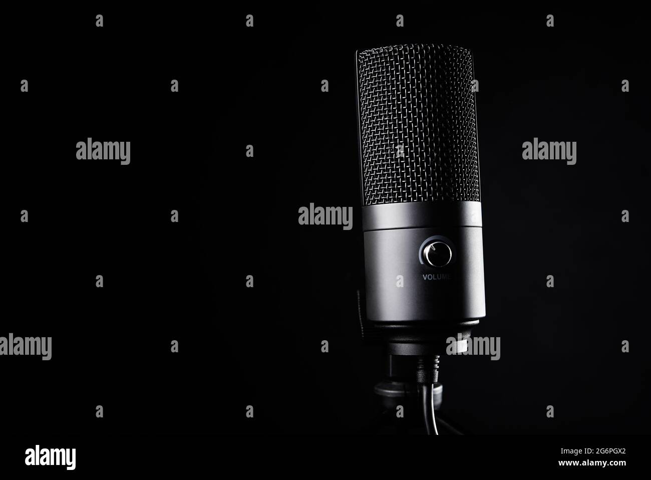 Studio microphone on dark background with copy space. Black ...