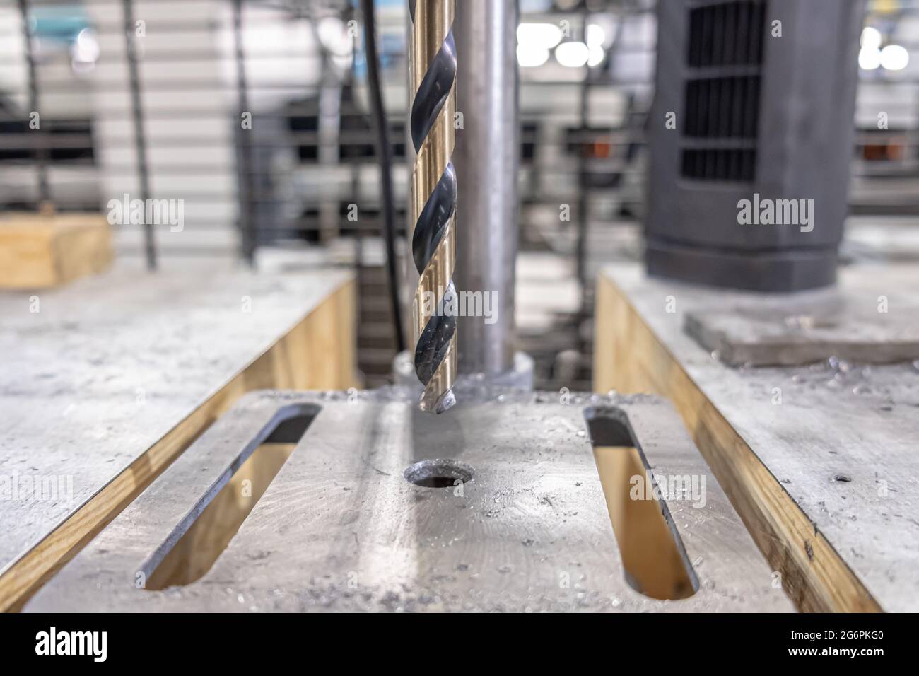 Large industrial drill bit machine on factory workshop floor Stock ...