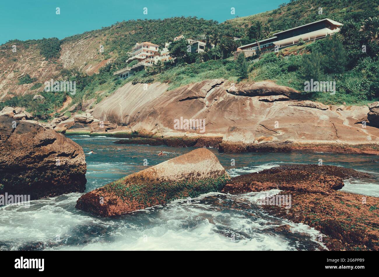 Natural view of rushing water flowing downstream against a rocky ...