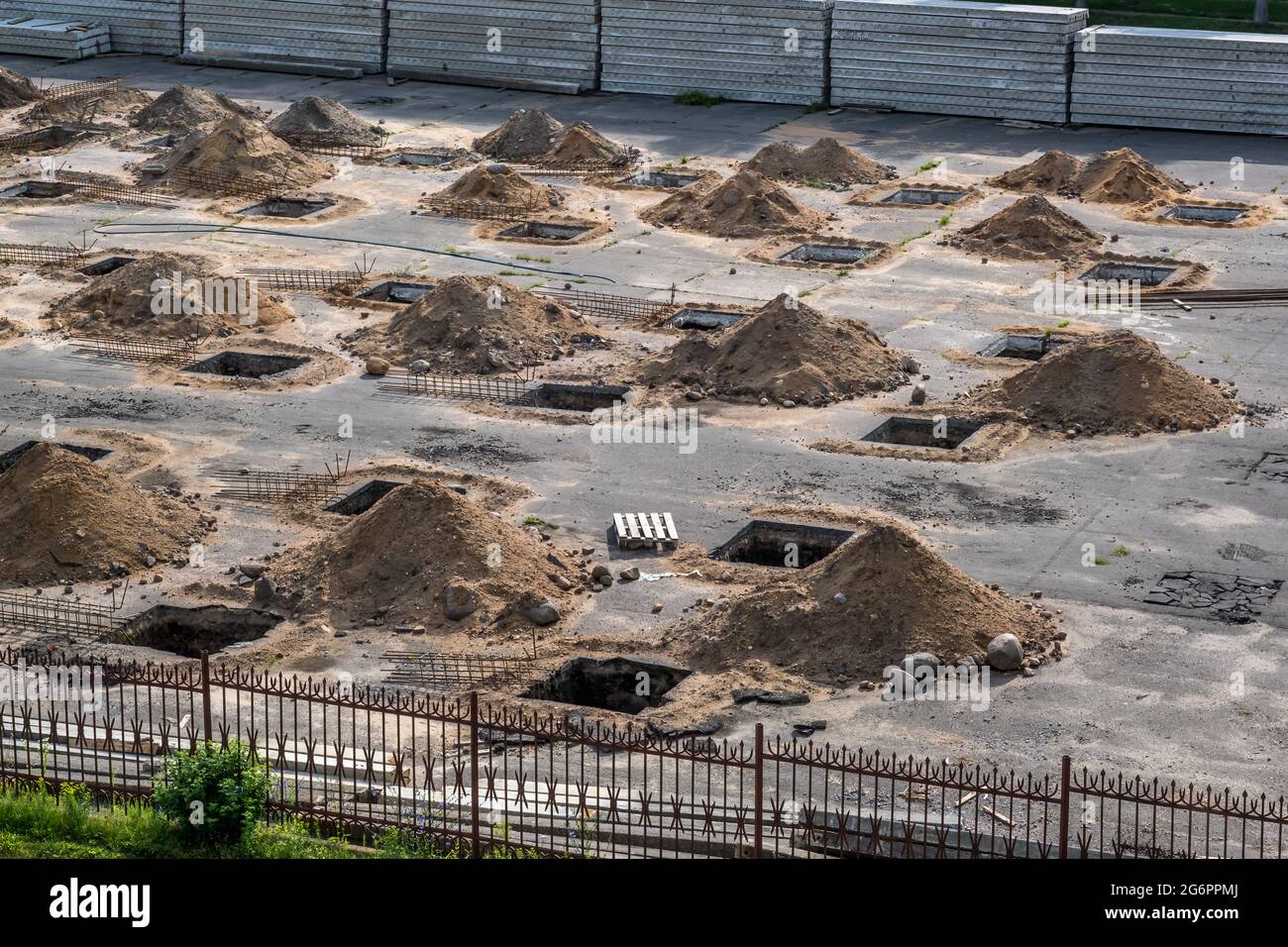 rows of pits at a construction site. preparation of the site for the ...