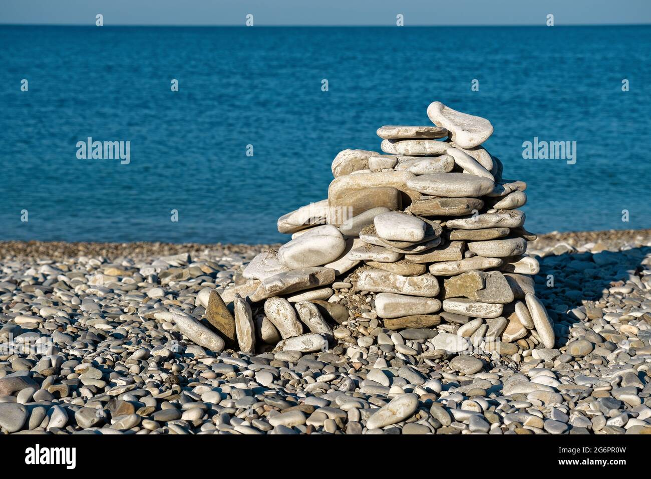 Stacked stone figure on the beach Stock Photo - Alamy