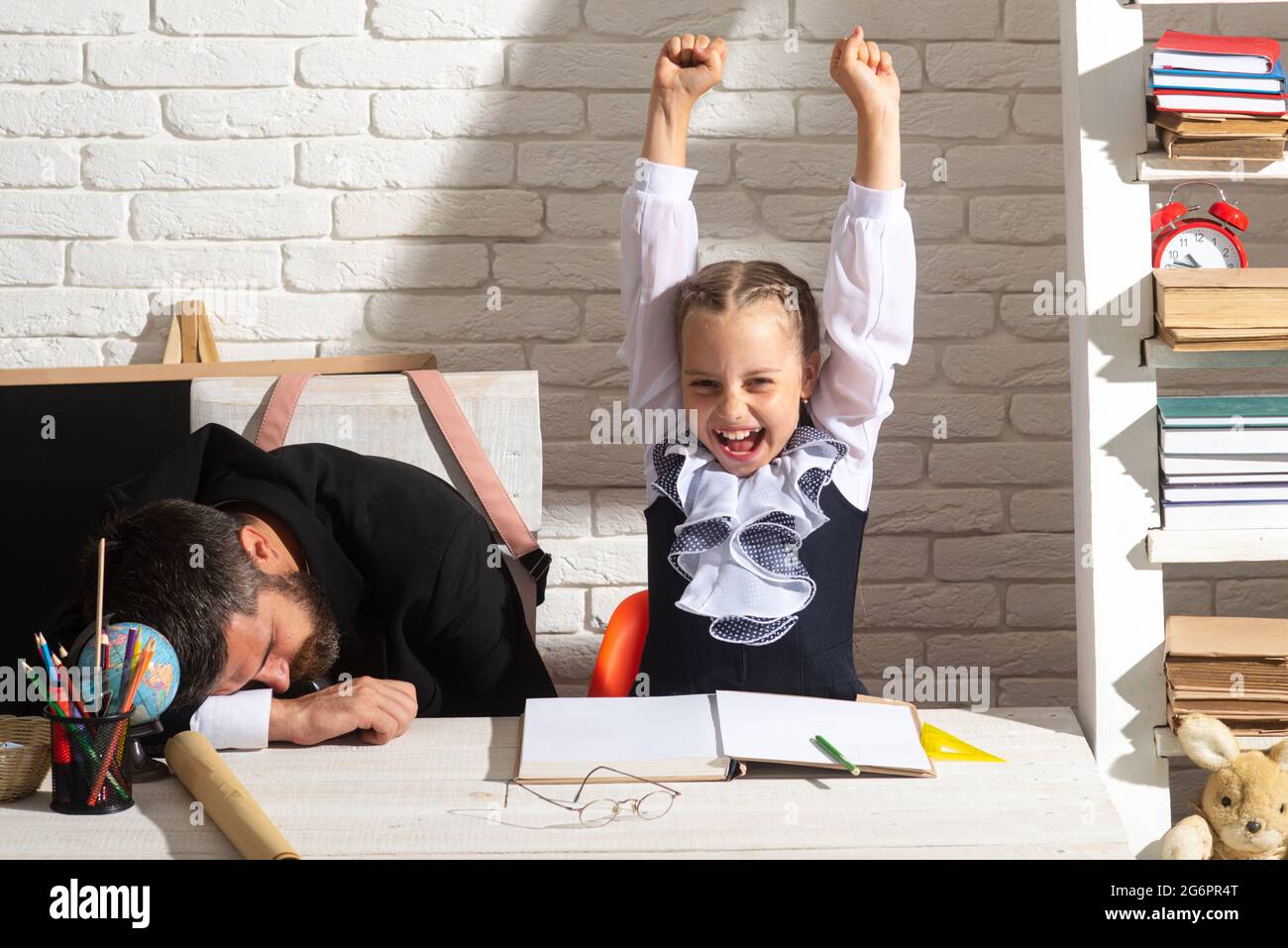 Tired teacher and excited pupil school girl. Stressed work in school ...