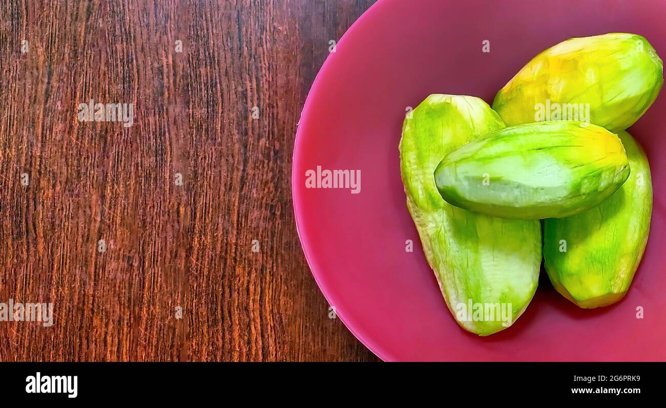 Tropical fruit green mango (kachha aam) on wooden table Stock Photo - Alamy