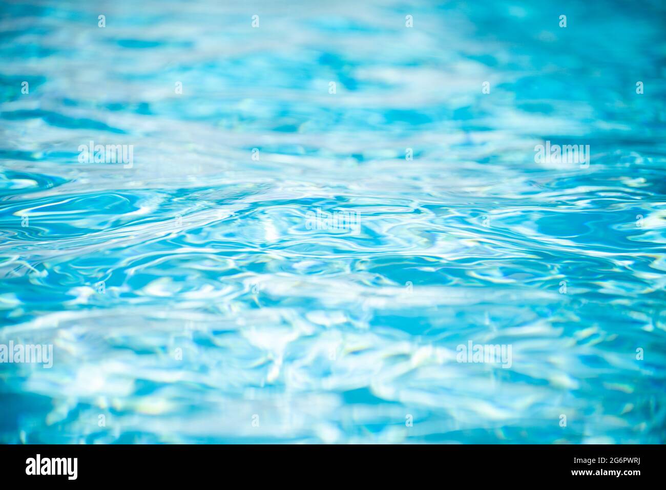Ripple Water in swimming pool with sun reflection. Wavy water ...