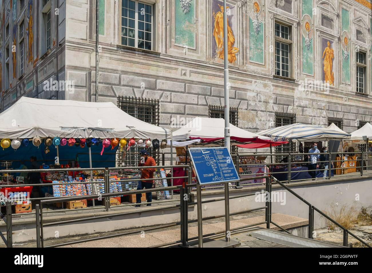 Glimpse of the street market in the old Dock district (Molo) of Genoa ...