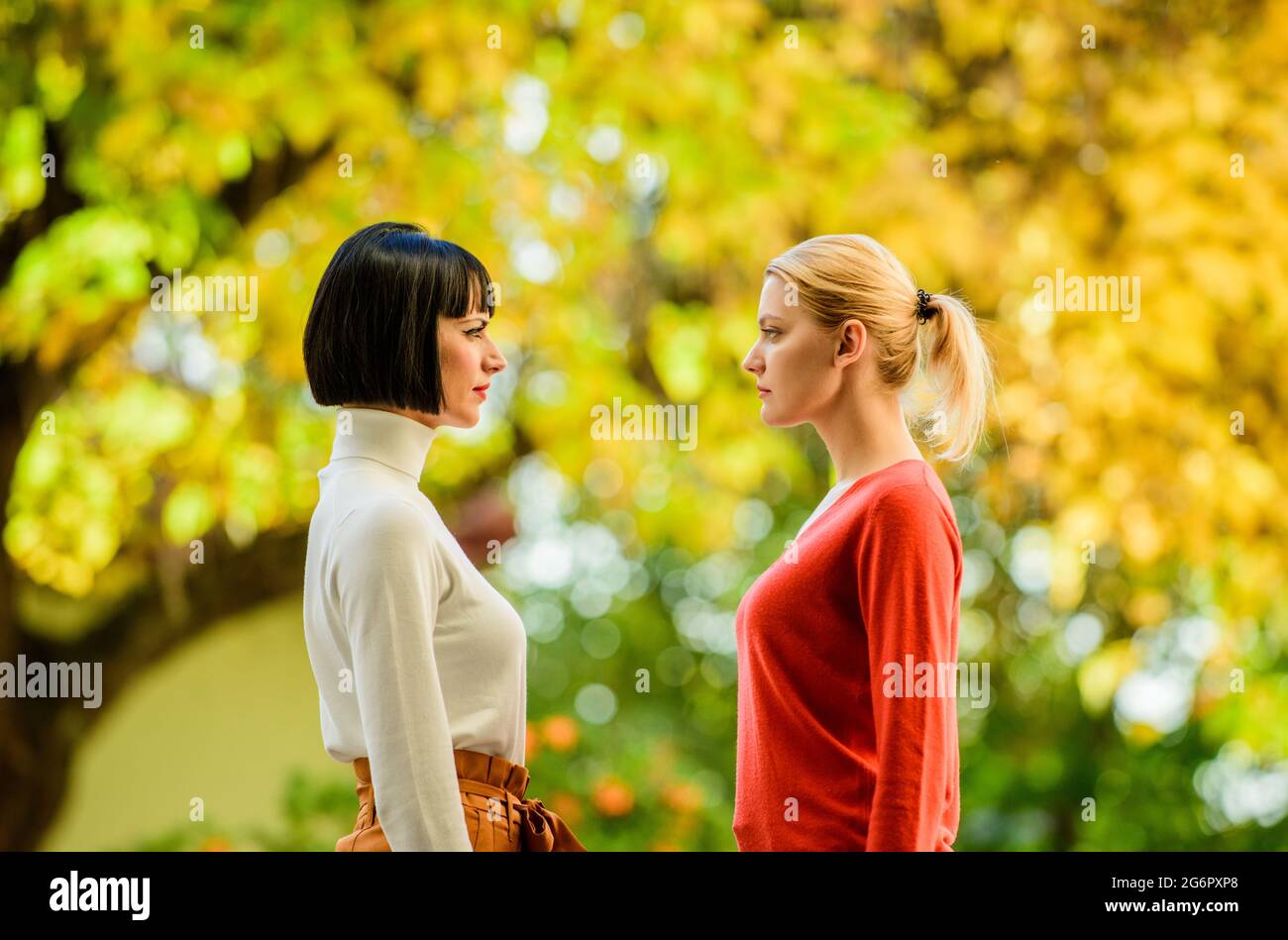 Eye contact. Women looking at each other with attention. Blonde ...