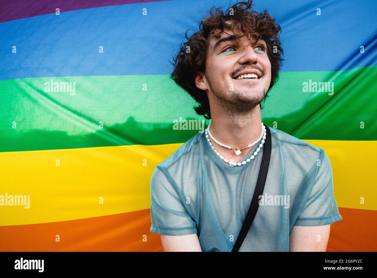 Carefree gay man embracing his identity. Happy young gay smiling ...