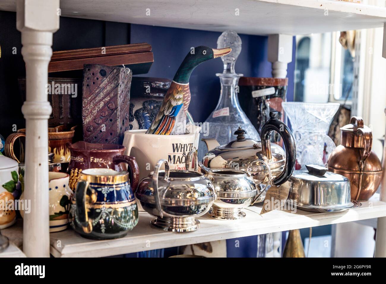 Sundry curiosities on a display shelf at an antique shop (Hampton Court ...