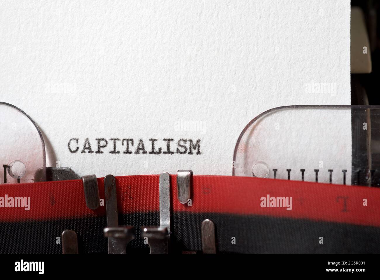 The word capitalism written with a typewriter Stock Photo - Alamy