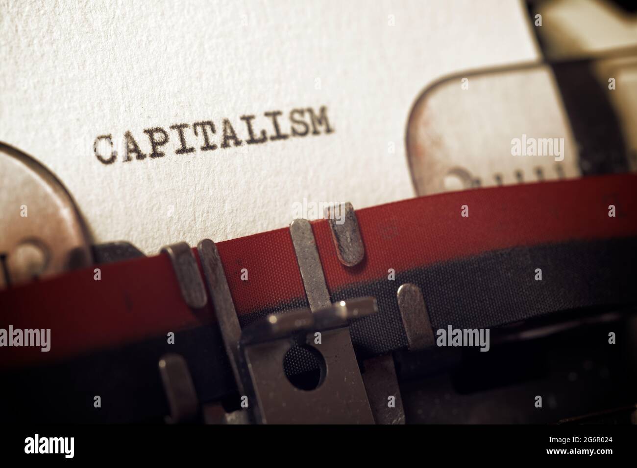 The word capitalism written with a typewriter Stock Photo - Alamy