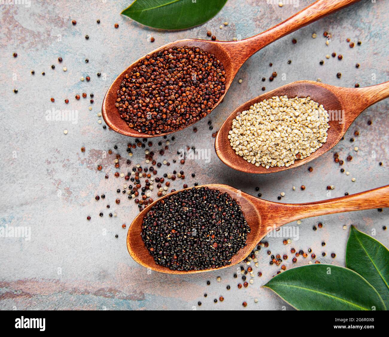 Red, black and white quinoa seeds on a concrete background Stock Photo ...