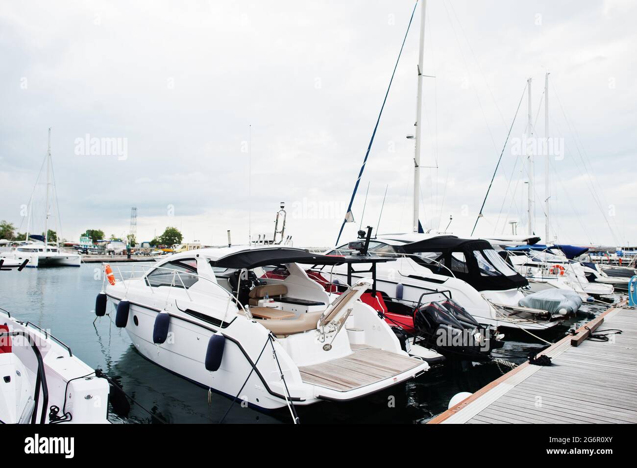 Marine parking of modern motor boats. Luxury yachts docked in sea port ...