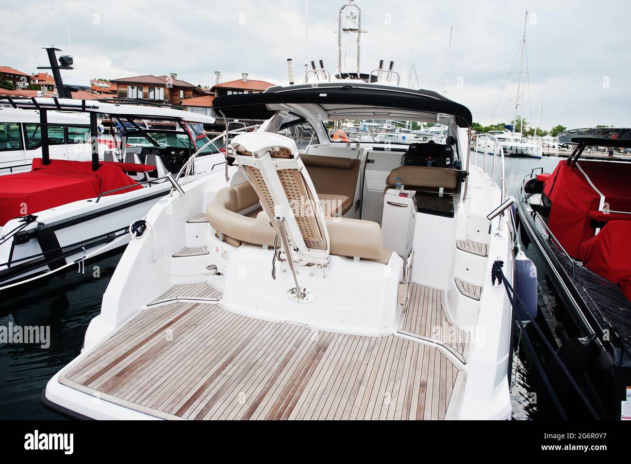 Marine parking of modern motor boats. Luxury yachts docked in sea port ...