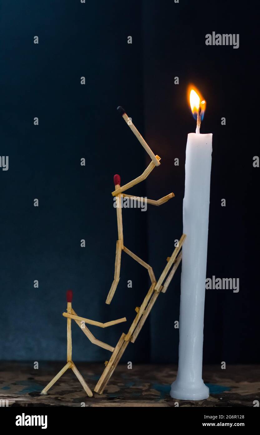 Matchsticks in form of a man lighting a candle, matchstick man lighting ...