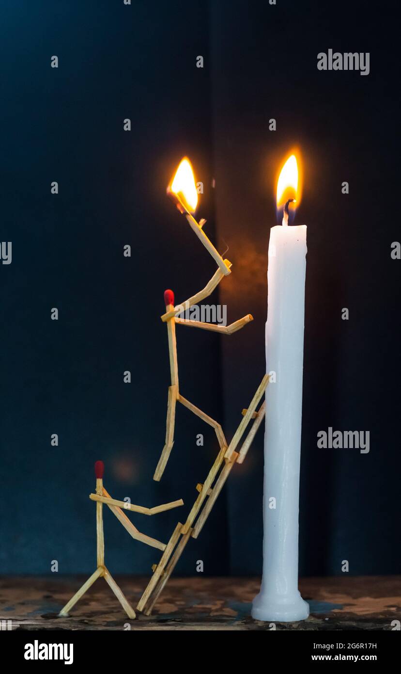 Matchsticks in form of a man lighting a candle, matchstick man lighting ...