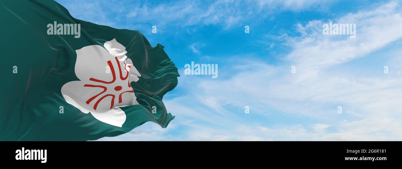 official flag of Saga prefecture waving in the wind on flagpoles ...