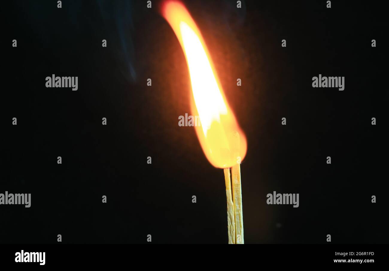 A couple of matches burning together with heat flame isolated on a ...