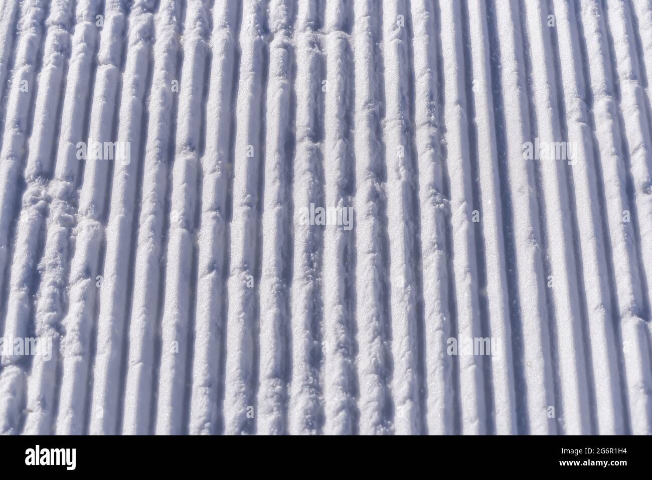 Snow lines texture made from a snow machine on a ski slope Stock Photo ...
