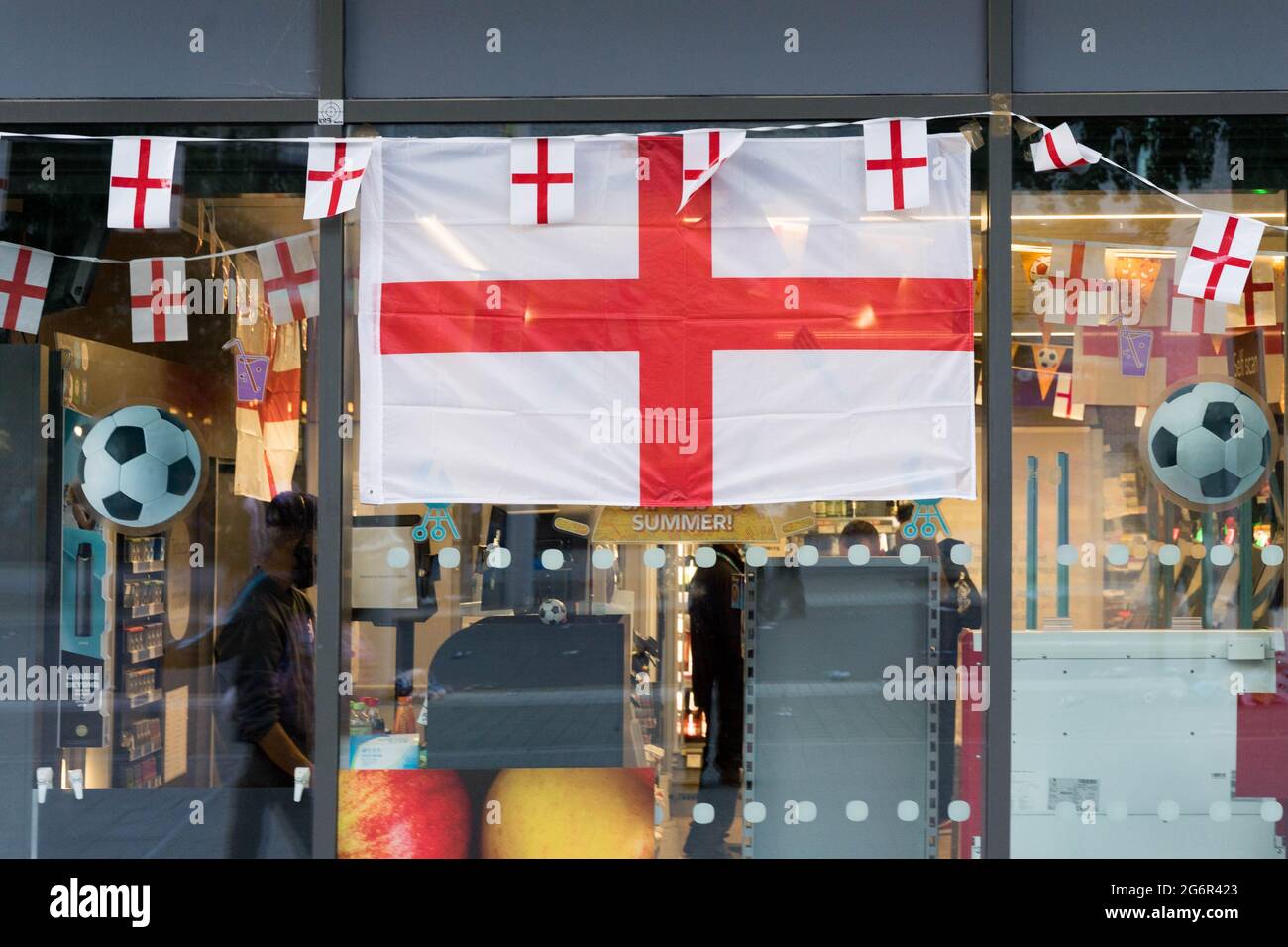 England flag on shop window at euro2020 semi vs Denmark at Wembley park ...