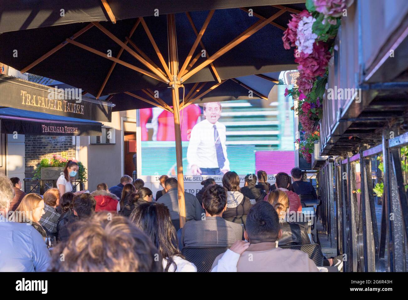 people watching euro 2020 football match at outdoor pub seating, London ...