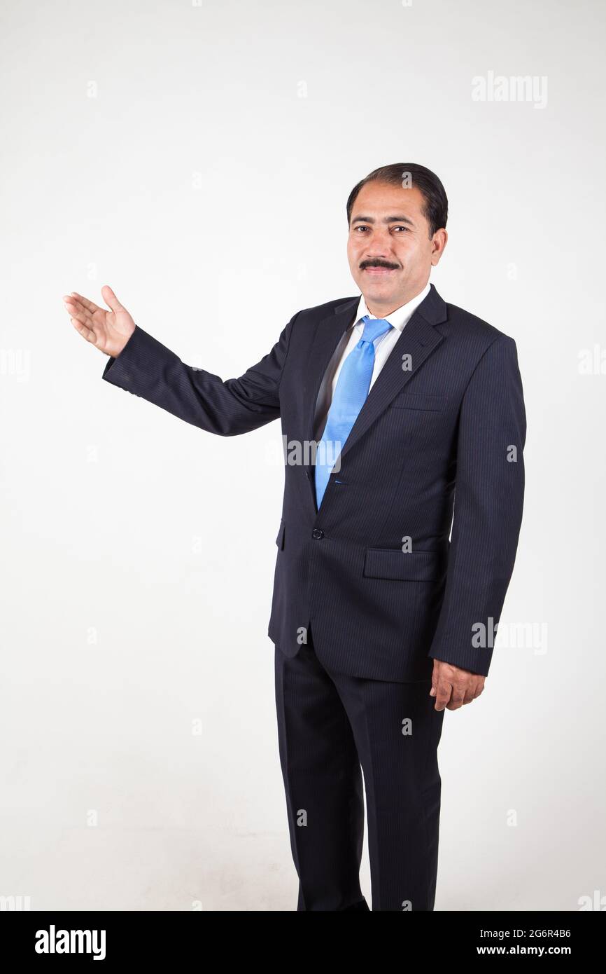 Mature senior company director CEO holding hand showing presentation ...